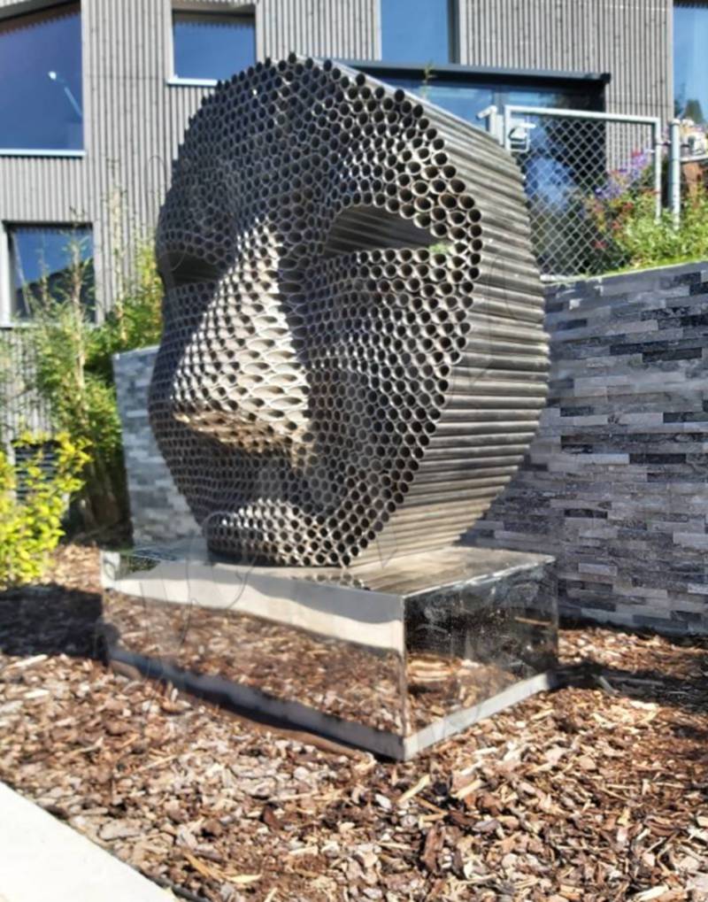 Modern Metal Pipe Faces Sculpture